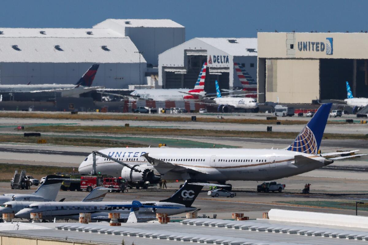 Should passengers who take bags in an evacuation be banned? | Airline ...